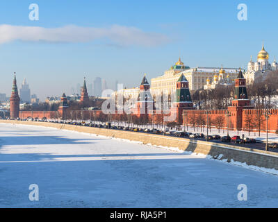 A view of the Kremlin and the ice-covered Moskva River during snowfall ...