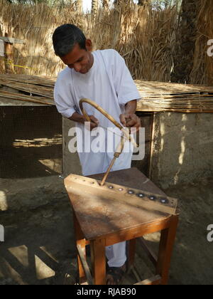 re-enacted scene of ancient Egyptian fire making, using a drill and ...