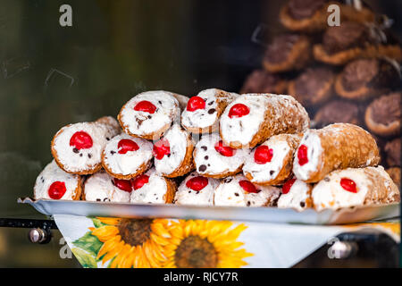 Closeup of cannoli stuffed with cream cheese whipped filling dessert on ...