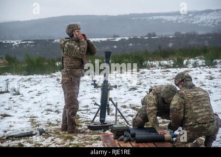 U.S. Army soldiers fire M252A1 mortar rockets during a night fire ...