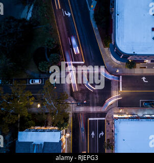 Aerial view of a four-way intersection on an expanse of green grass in ...