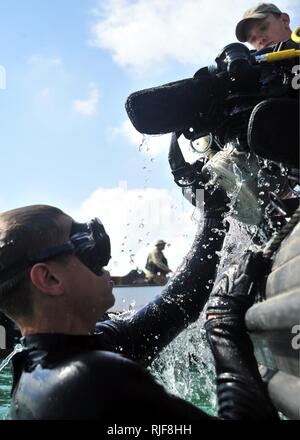 Navy Diver 2nd Class David Lang, assigned to the Naval Base Guam Dive ...
