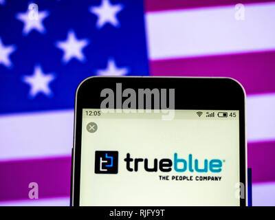 Ukraine. 6th Feb, 2019. TrueBlue Company logo seen displayed on a smart ...