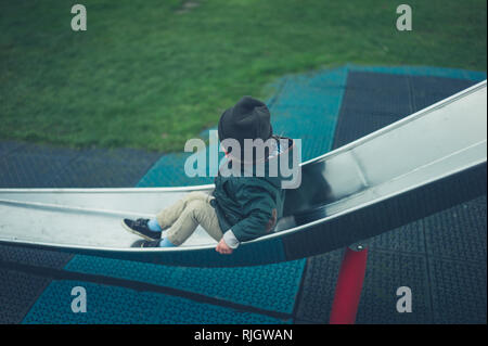 Little going down slide Stock Photo - Alamy