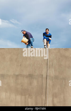 Bodrum, Turkey - January 2019: Two Turkish construction workers working ...