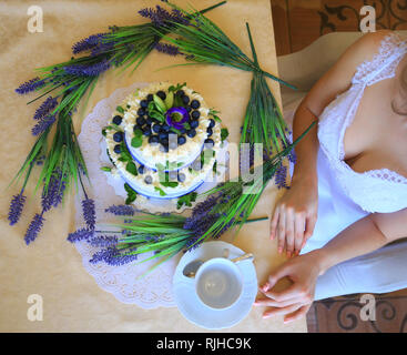 of fruit, cheese and milk while sitting in a chair at a table. Fort ...