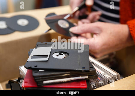 Cutting up old floppy disc with scissors to destroy information Stock ...