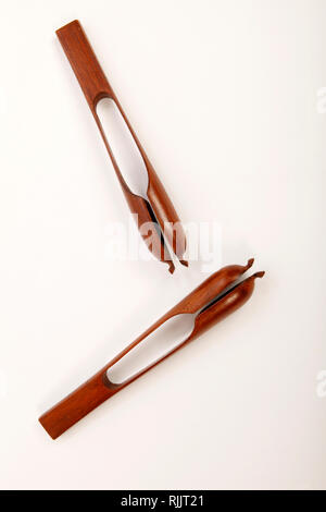 Pair of single handed hardwood rosewood clackers Stock Photo - Alamy