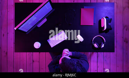 Hacker with evil look programing Stock Photo - Alamy