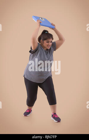 Angry Overweight Woman Frustrated From Her Weight Throwing Scale Stock ...
