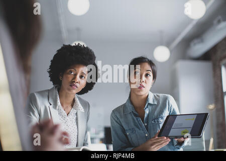 Businesswomen presenting to a client Stock Photo - Alamy