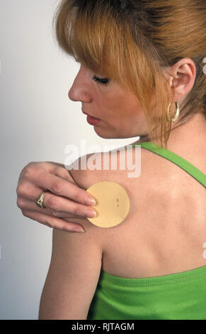 Portrait of middle aged woman smoking cigarette while standing outdoor ...