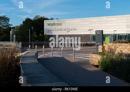 Sign at the entrance to a Waitrose supermarket car park listing store ...