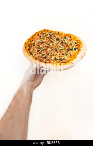 hand holding slice pizza isolate on white background Stock Photo - Alamy