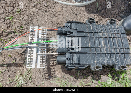 fiber optic cables been installed underground in dug trenches front of ...
