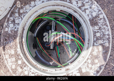 fiber optic cables been installed underground in dug trenches front of ...