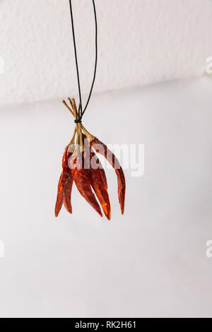 bunch of the dried chilli on the white background Stock Photo - Alamy