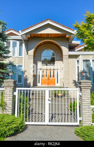 A luxury house with the gates in suburbs in Vancouver. Custom built ...