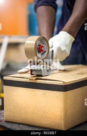 line of assembly of cardboard packaging in boxes and finished products ...
