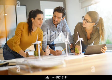 Attractive colleagues looking over ideas in co working space Stock ...
