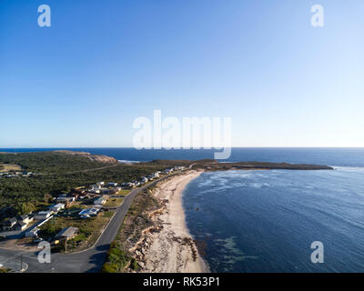 Aerial of holiday homes in the historic coastal village of Elliston ...