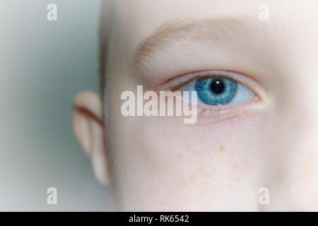 Baby blue beautiful, brooding eyes of a boy Stock Photo - Alamy