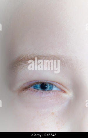 Baby blue beautiful, brooding eyes of a boy Stock Photo - Alamy