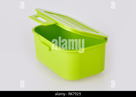 Set of similar closed green plastic food storage container isolated on ...