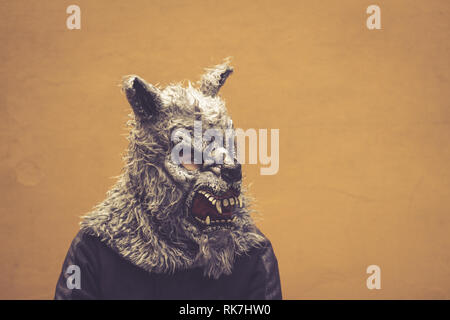 Photograph of a person with a wolf mask Stock Photo - Alamy
