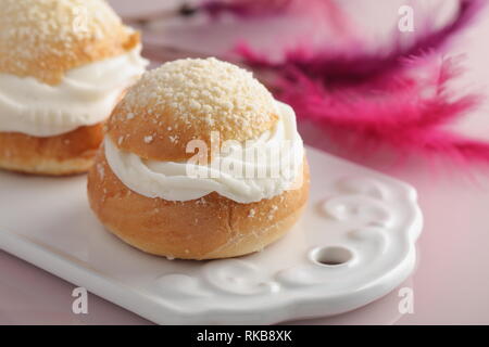 Fastelavn buns on a cutting board against Fastelavn decorations Stock ...