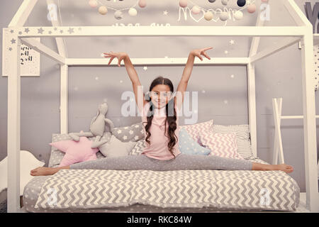 Time for evening stretching. Cute gymnast practice split before go to ...