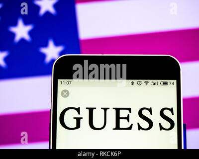 Guess Clothing company logo seen displayed on a smart phone Stock Photo ...
