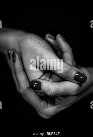 Two hands touching knuckles together Stock Photo - Alamy