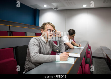 Man sitting supervised Mensa IQ test at University College London ...