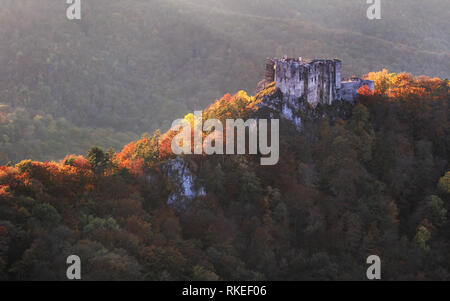 Mountain autumn landscape with colorful forest and Uhrovec castle ...