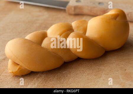 Traditional smoked Slovakian semi fat, steamed cheese on white ...