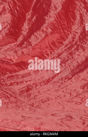 Red tarpaulin, background picture Stock Photo - Alamy