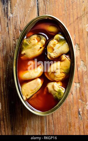 Close up of canned seafood - mussels in oil. Isolated over white ...