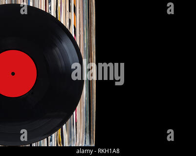 An isolated shot of a stack of vinyl music records on a white ...