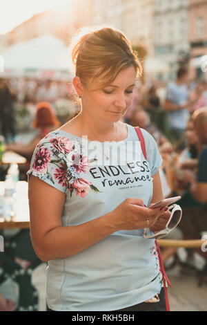 Call center. Beautiful young woman using headset and computer to help ...