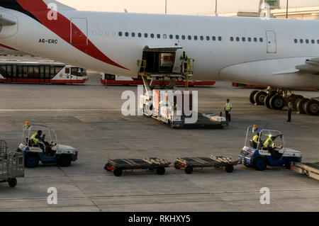 Loading air cargo on board a commercial jet plane. International ...