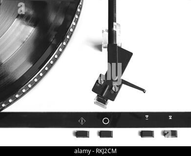 Turntable with black tonearm in silver case with rubber mat on disc ...