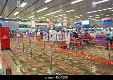 SINGAPORE - AUGUST 28, 2016: Emirates check-in counters at Singapore ...
