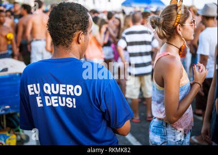 Young brazilian woman wearing shirt standing over isolated white ...