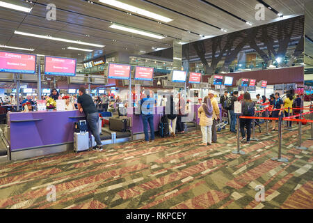 SINGAPORE - AUGUST 28, 2016: Emirates check-in counters at Singapore ...
