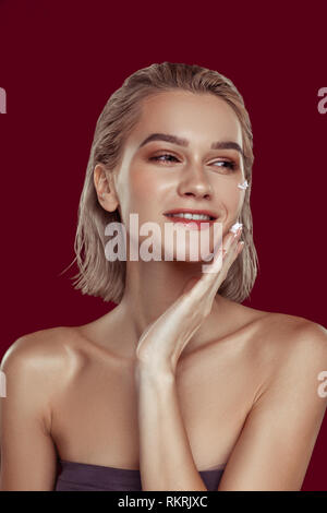 Appealing woman enjoying makeup session with stylist Stock Photo - Alamy