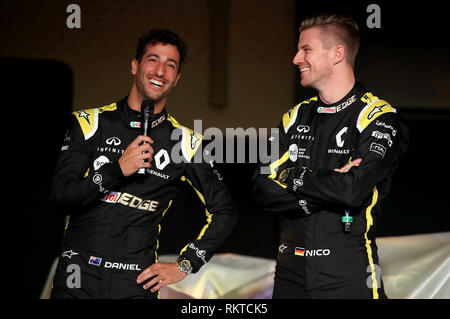 Drivers Nico Hulkenberg (right) and Daniel Ricciardo pose with retired ...