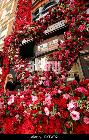 A gallery assistant tends to the augmented reality Valentine's Day ...