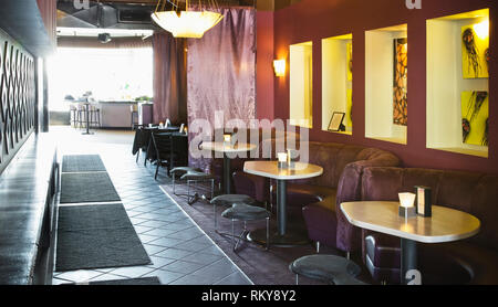 Tables and booths in empty nightclub Stock Photo - Alamy