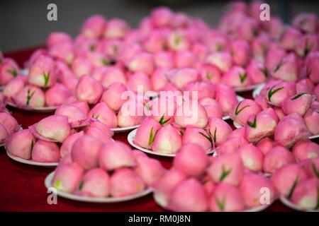 Pink Chinese peach birthday bun food named Longevity peach shoutao on ...